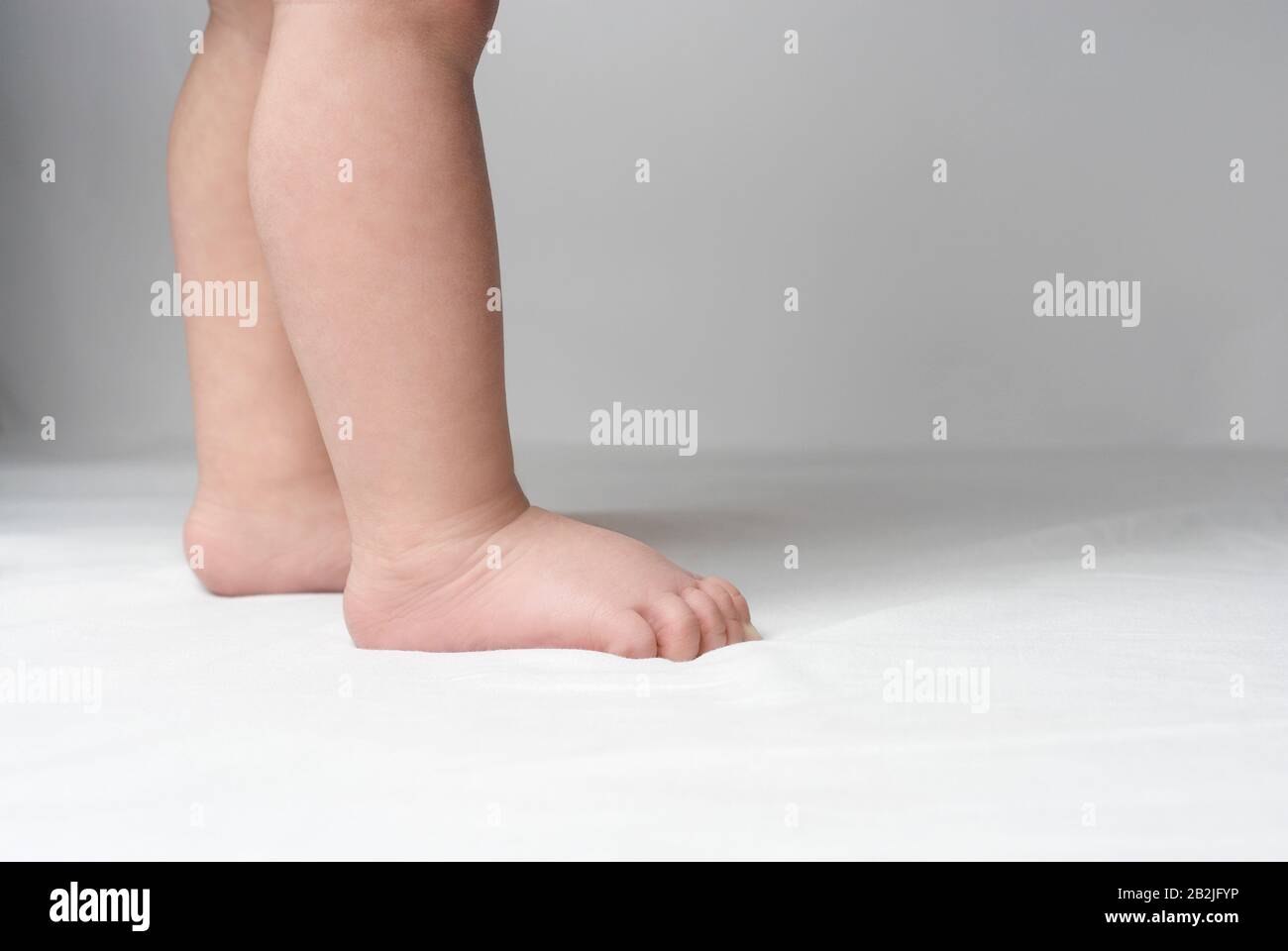 Baby (6-12 months) standing low section Stock Photo - Alamy