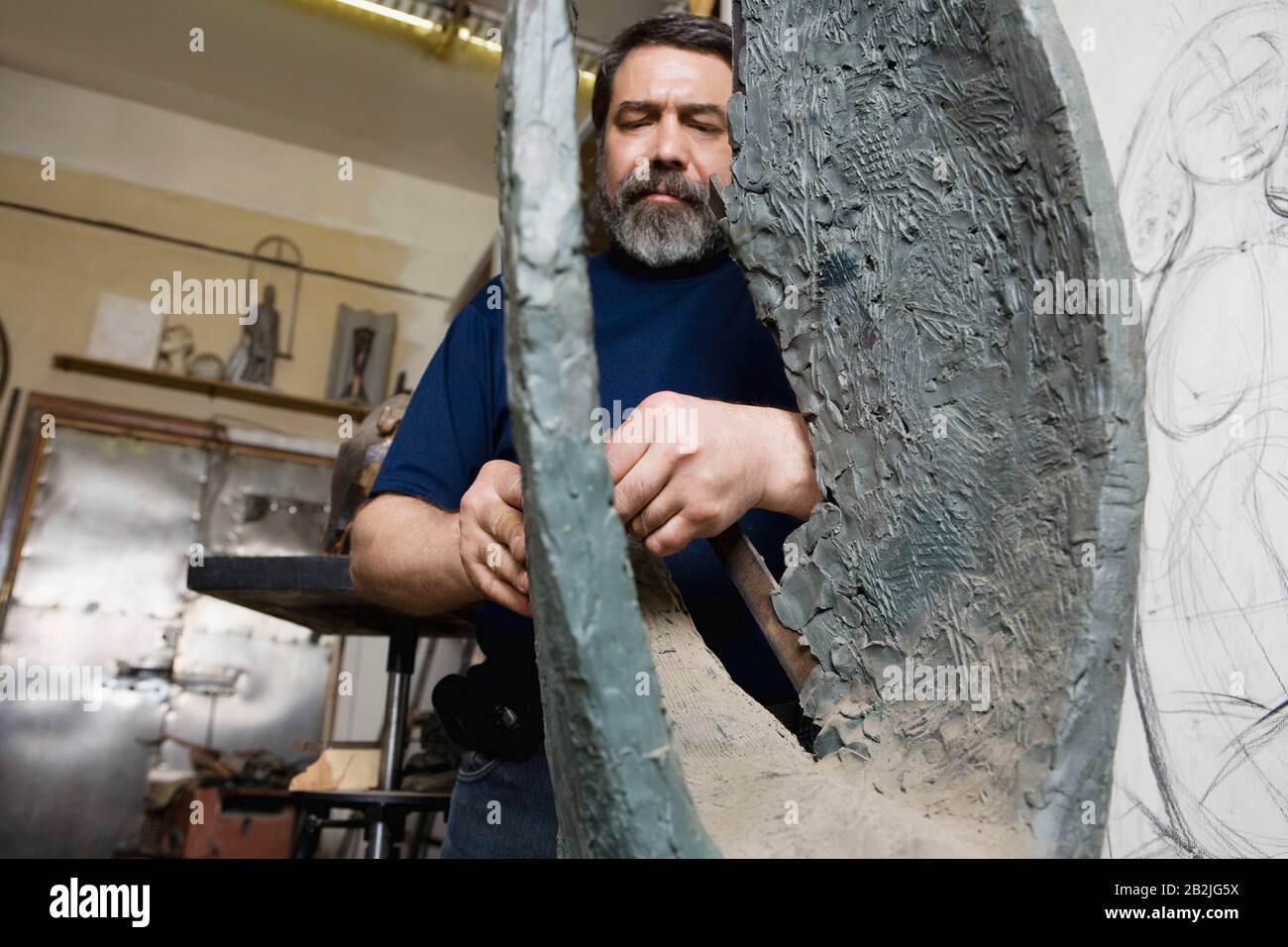 Sculptor Working in His Studio Stock Photo - Alamy