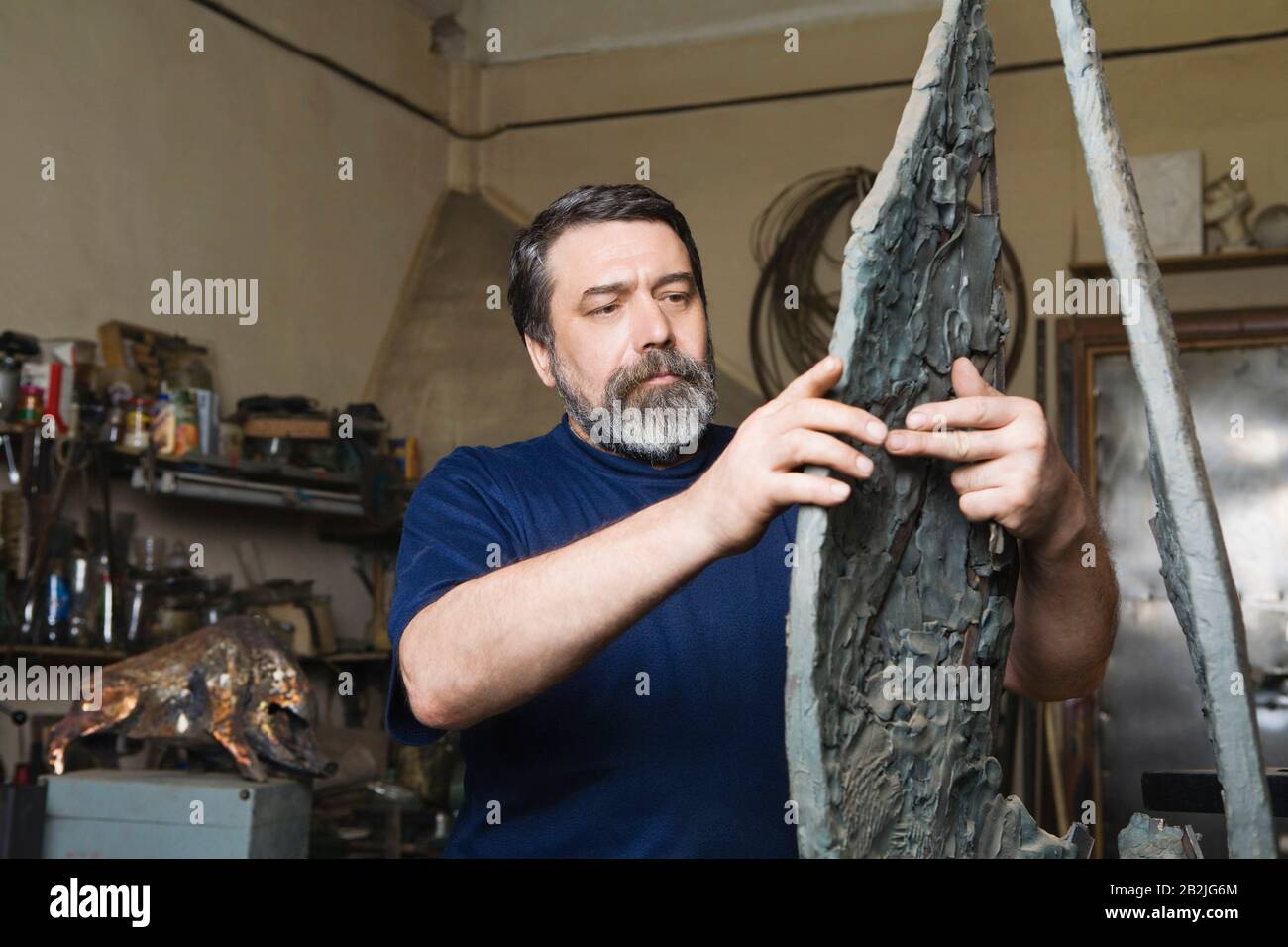 Sculptor Working in His Studio Stock Photo - Alamy