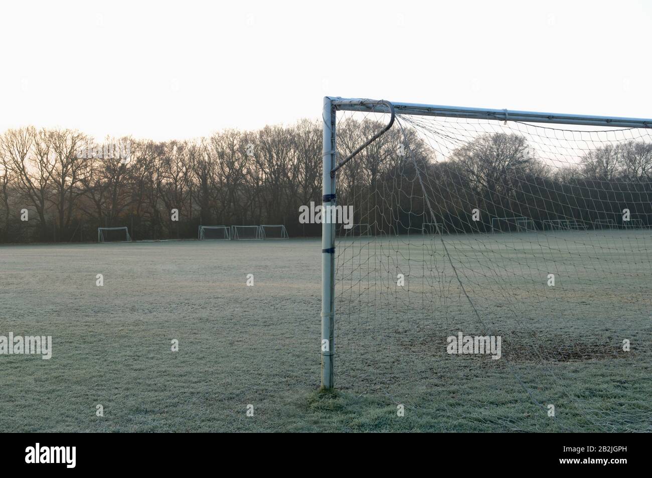 Goal post on empty soccer field Stock Photo - Alamy
