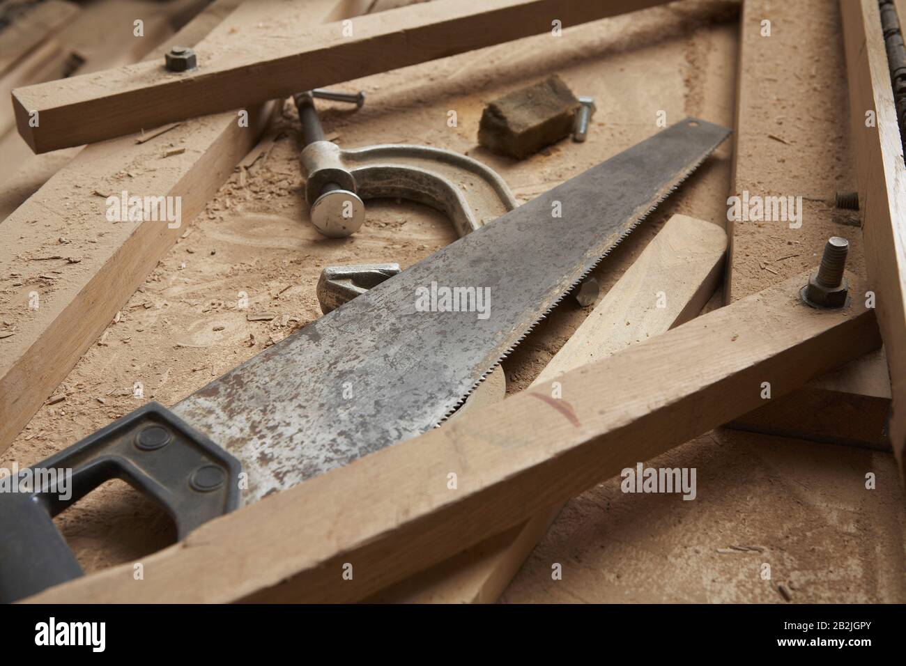 Carpenter's Saw and Clamp Among Wood Shavings Stock Photo - Alamy