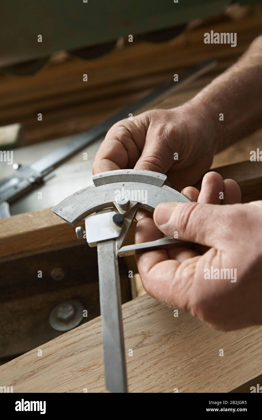 Carpenter Adjusting Calipers Stock Photo - Alamy