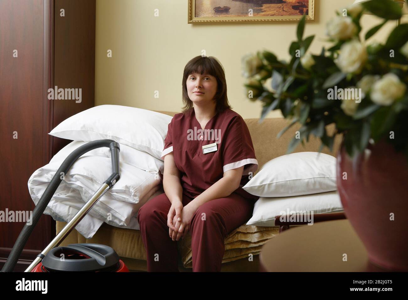 Old woman maid uniform hi-res stock photography and images - Alamy