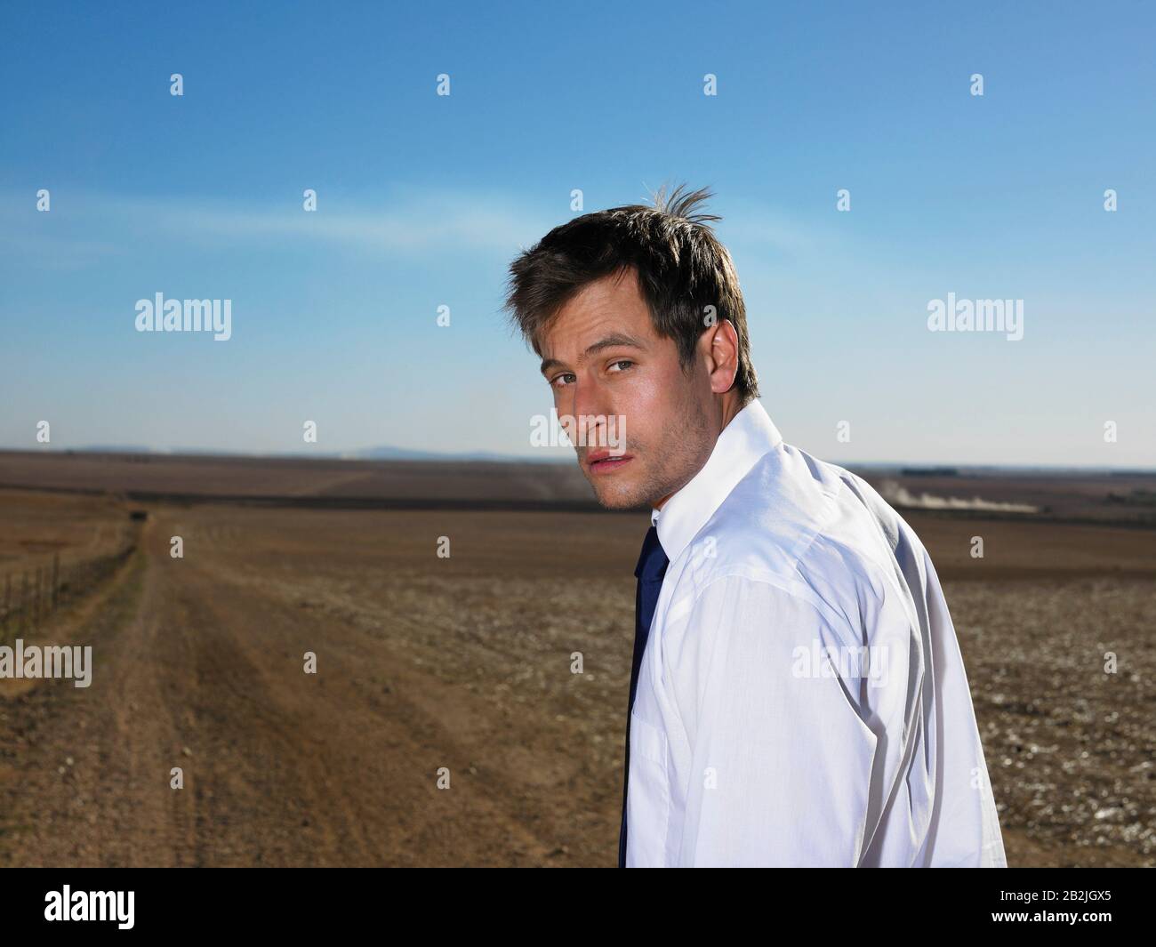 Man looking over shoulder running hi-res stock photography and images ...