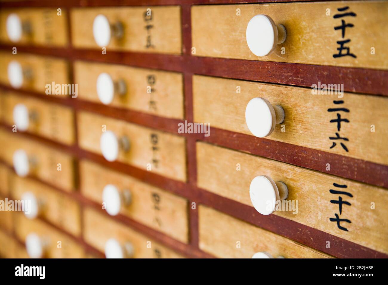 Small Wood Drawers With White Handles Stock Photo - Alamy
