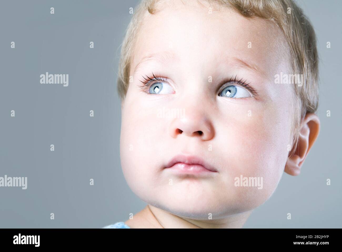 Boy looking up Stock Photo - Alamy