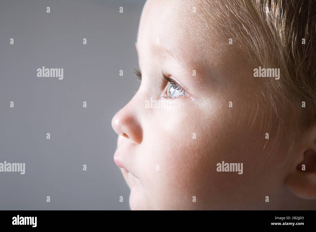 Boy looking up Stock Photo - Alamy