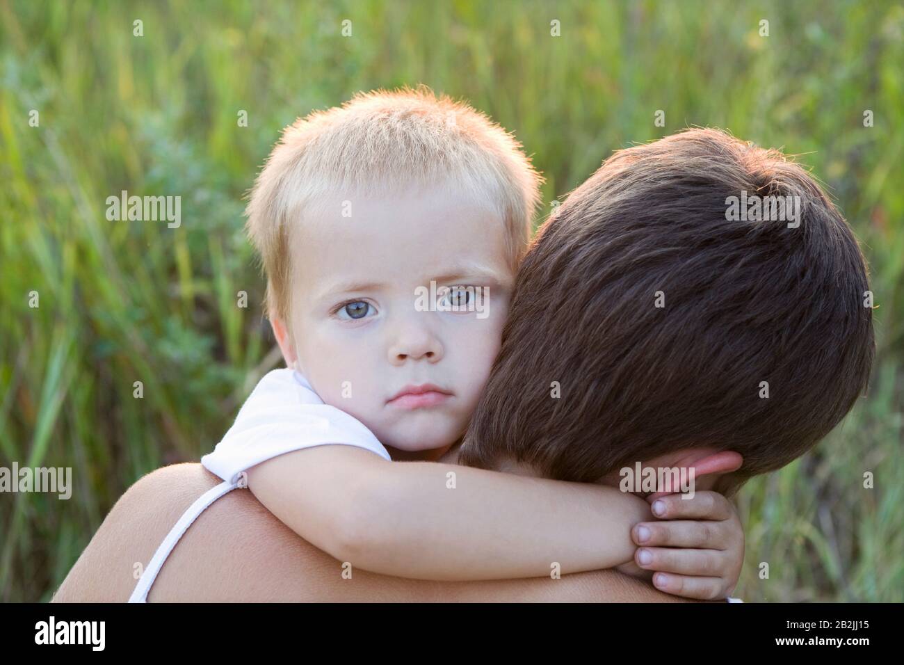 Little Boy Hugging His Mother Stock Photo - Alamy