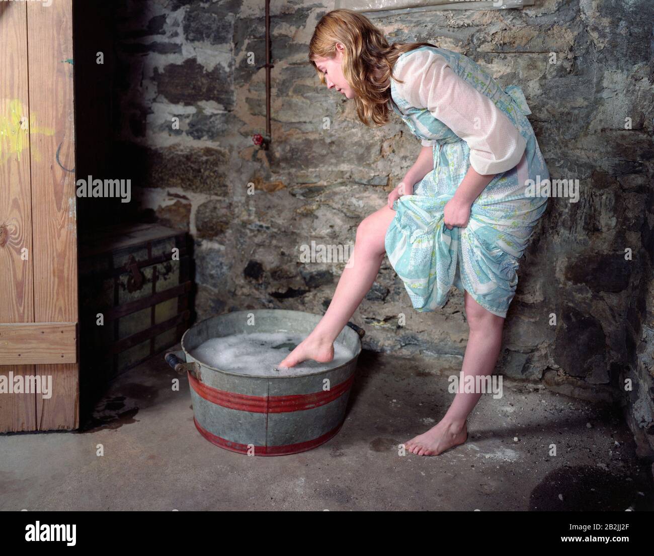 Woman Washing Her Feet Stock Photo - Alamy