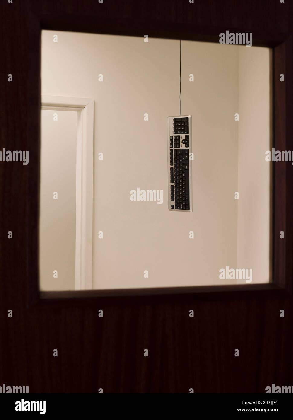 Keyboard hanging from ceiling Stock Photo - Alamy