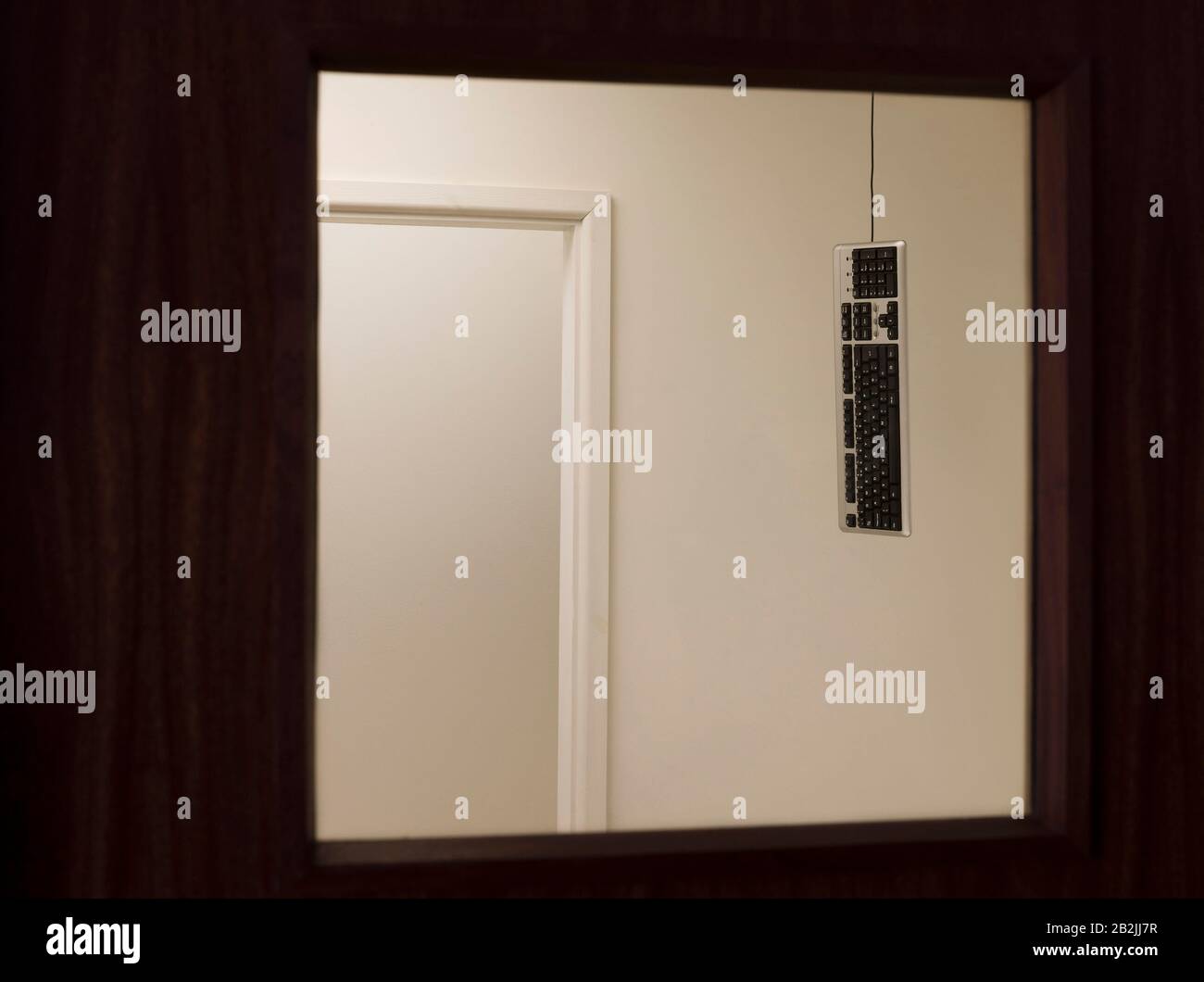 Keyboard hanging from ceiling Stock Photo - Alamy