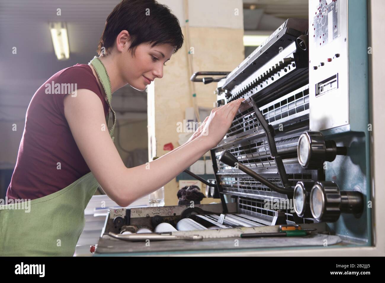 Women operating printing press hi-res stock photography and images - Alamy
