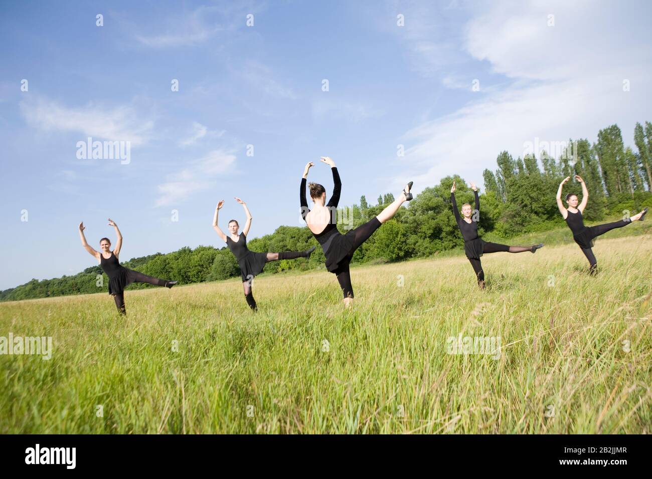 Group women dancing outdoors field hi-res stock photography and images ...
