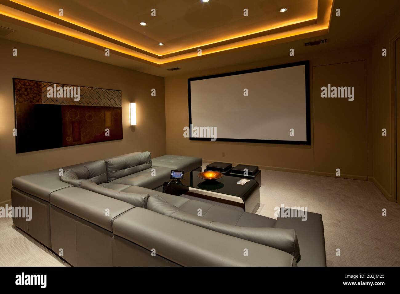 Empty media room with leather furniture in luxury villa Stock Photo - Alamy