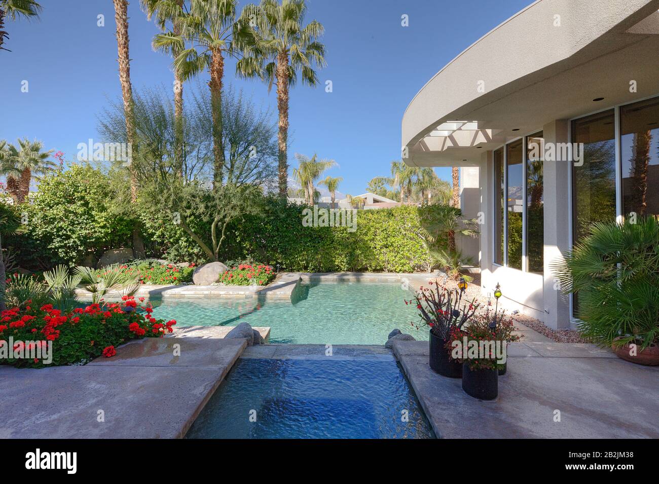 Swimming pool outside villa Stock Photo - Alamy
