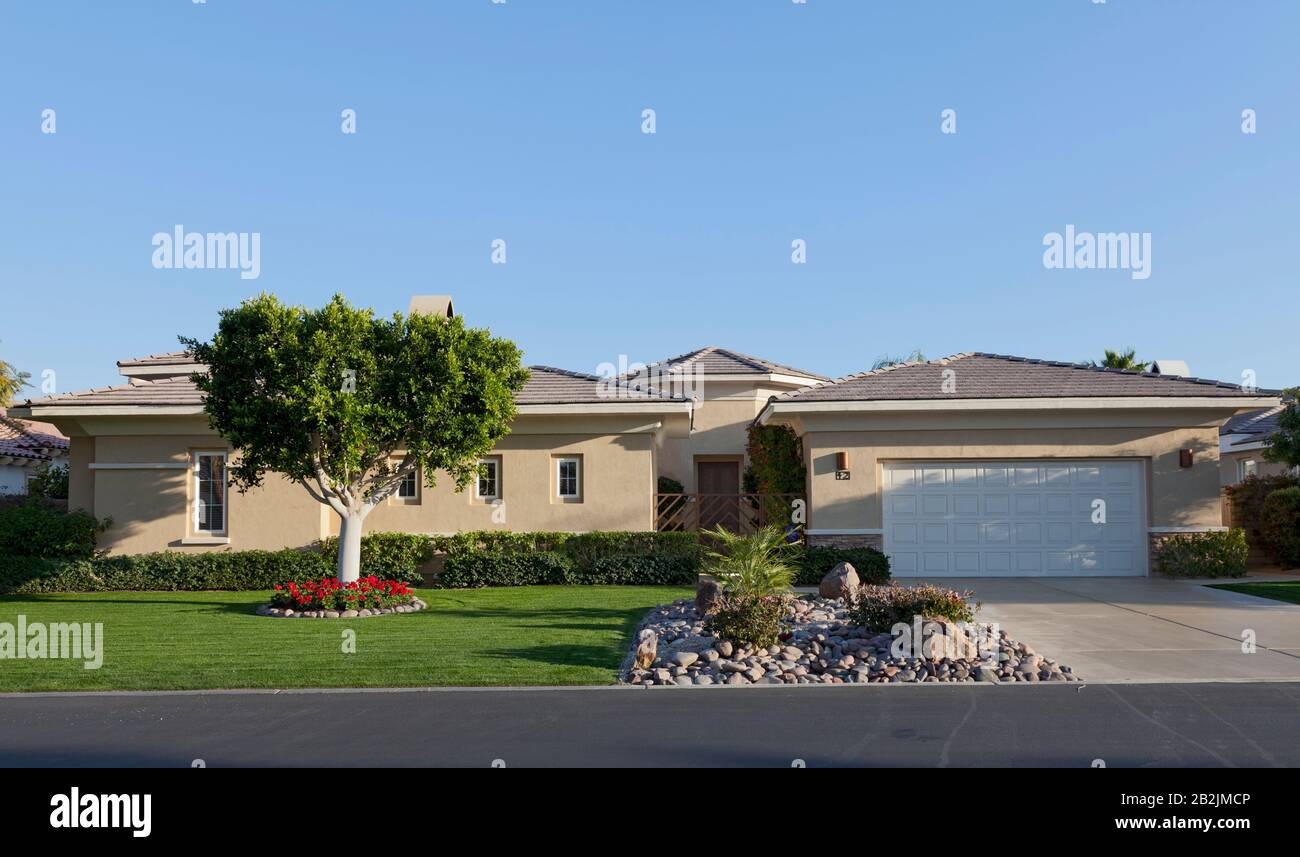 Front of house with lawn and driveway Stock Photo - Alamy