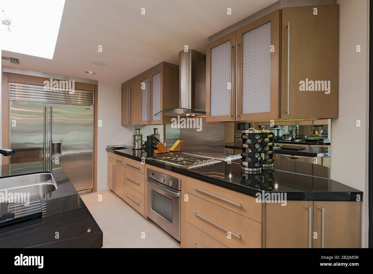 Contemporary kitchen counter and stove in mansion Stock Photo - Alamy