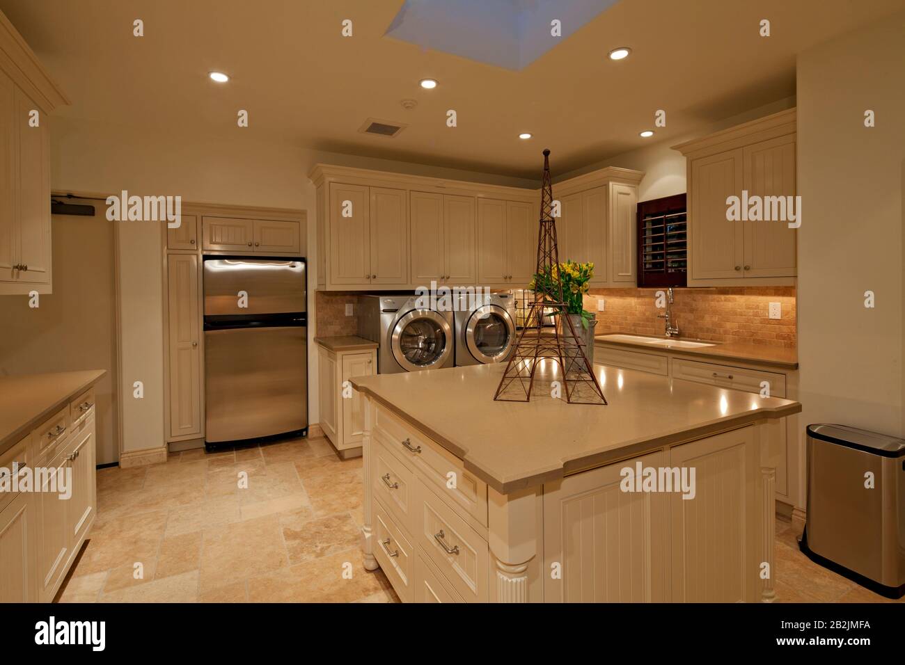 Modern kitchen counter with showpiece in manor house Stock Photo - Alamy