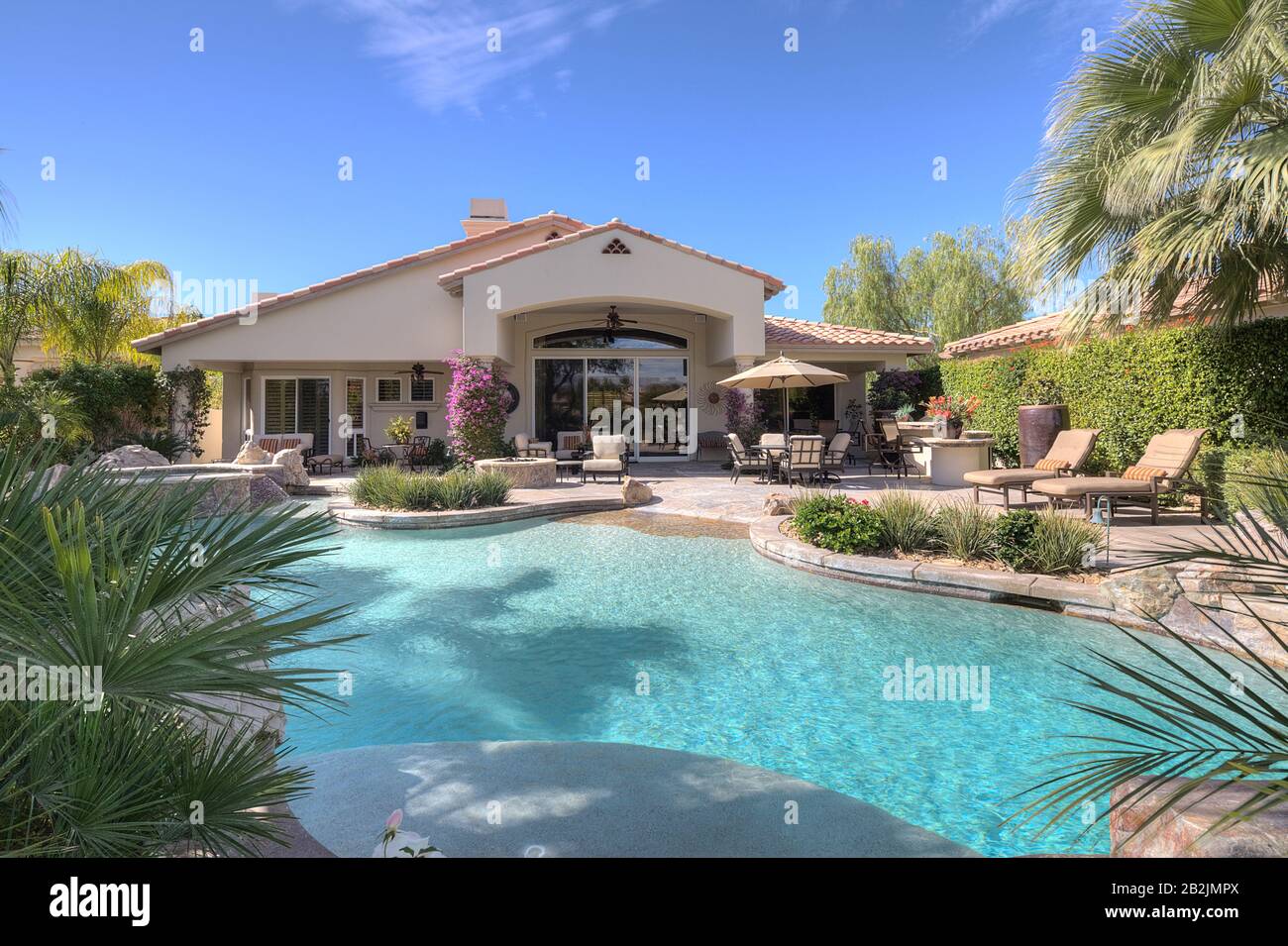 Swimming pool in luxury villa Stock Photo - Alamy