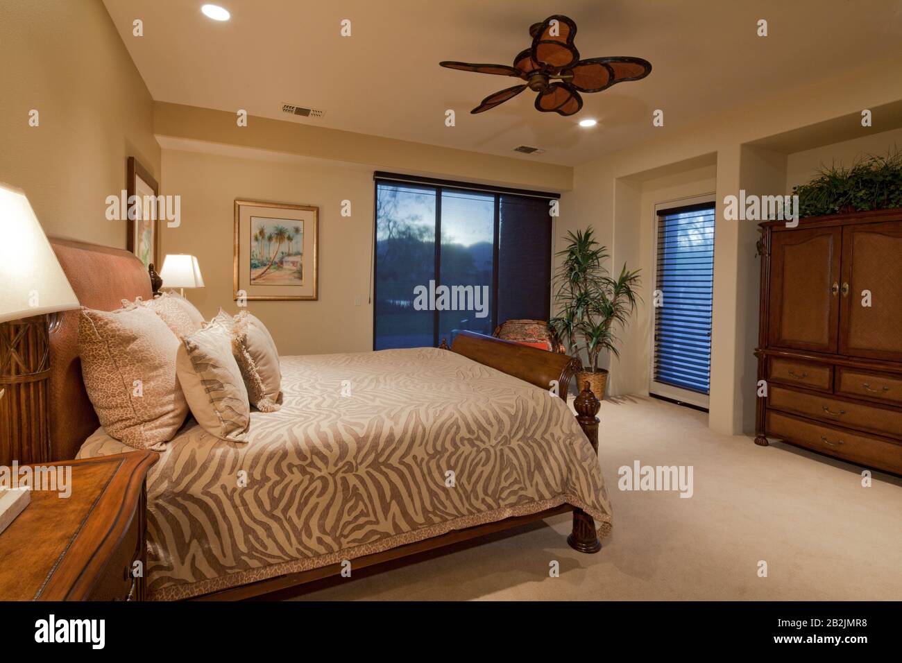 Bedroom with ceiling fan in manor house Stock Photo - Alamy