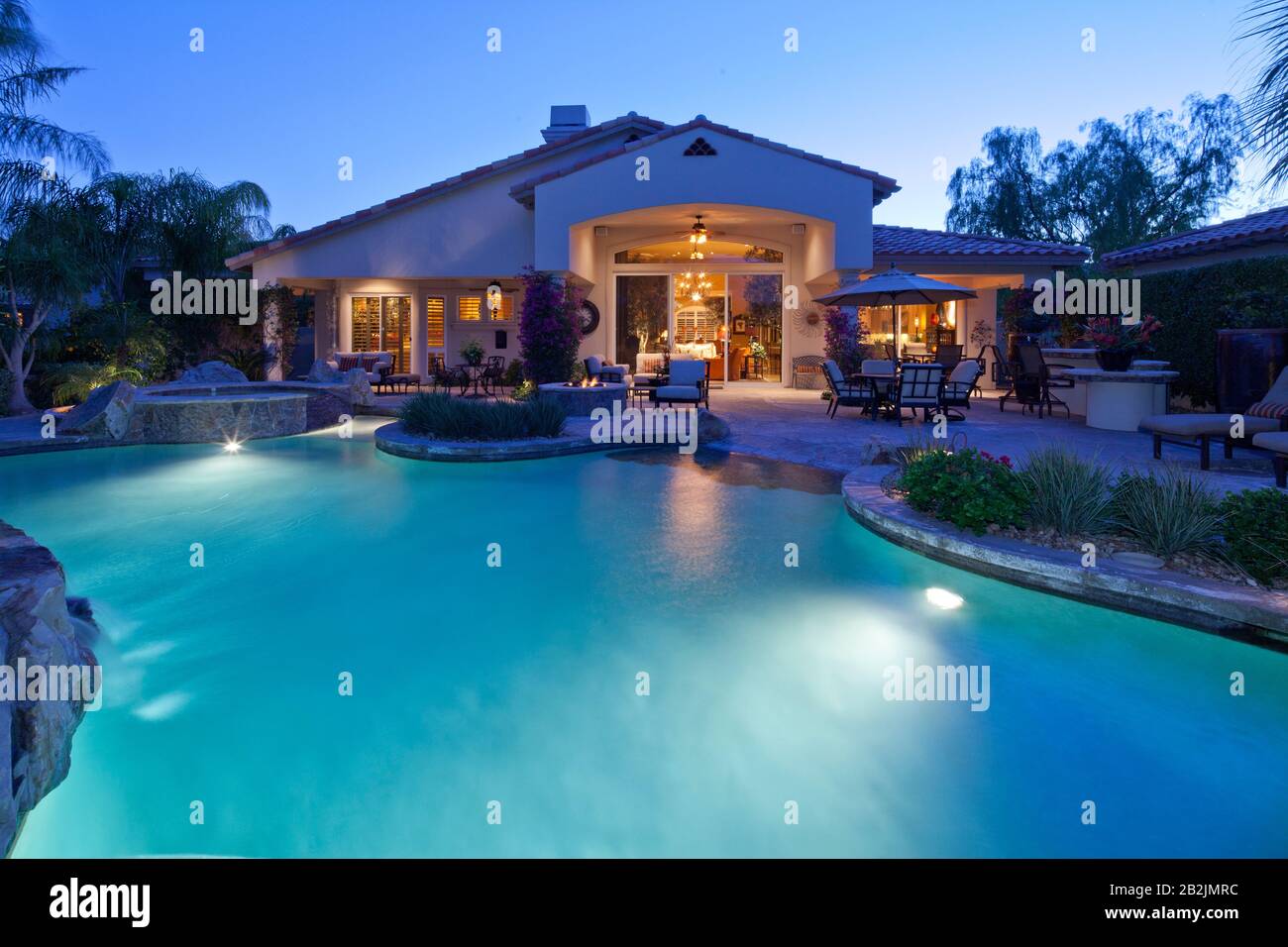 Swimming pool in manor house in evening Stock Photo - Alamy