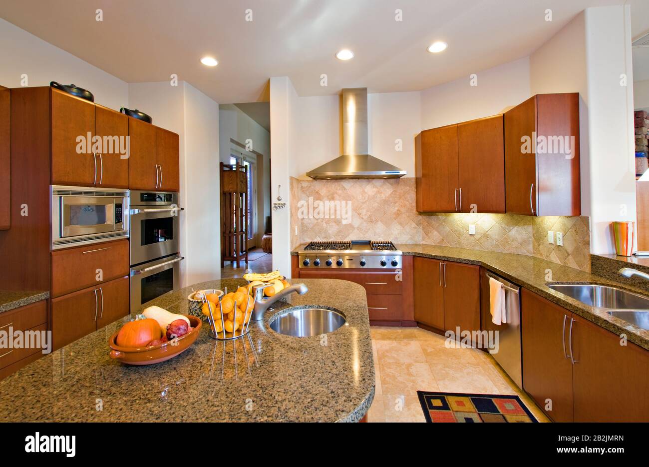 Modern kitchen with fruits on counter in manor house Stock Photo - Alamy