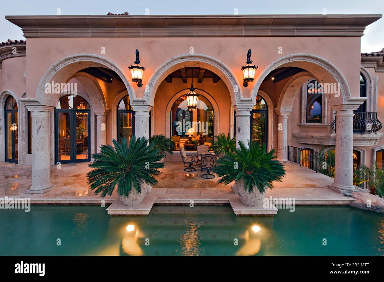 View of patio of with swimming pool in manor house Stock Photo - Alamy