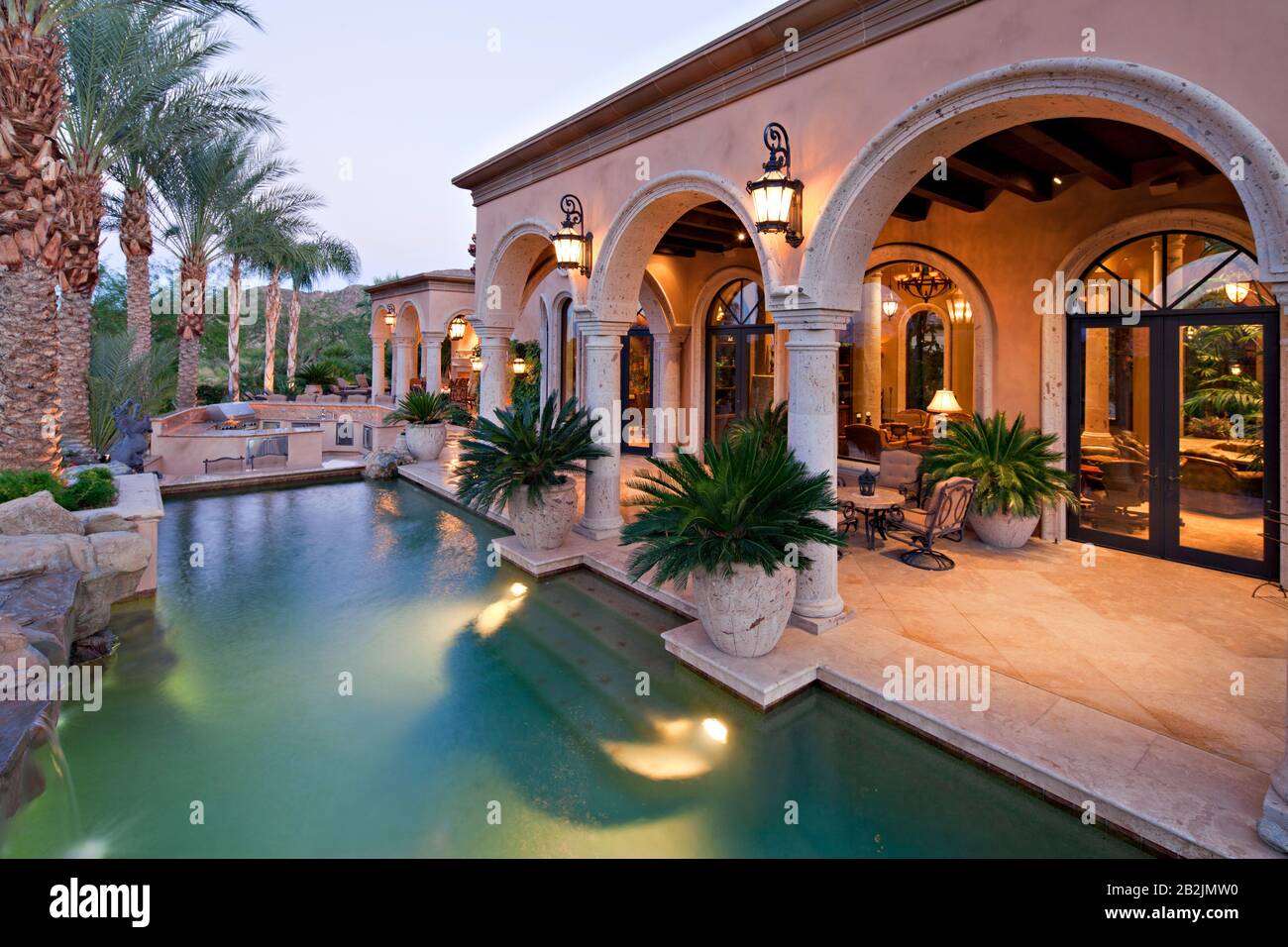 Swimming pool with patio of luxury villa Stock Photo - Alamy