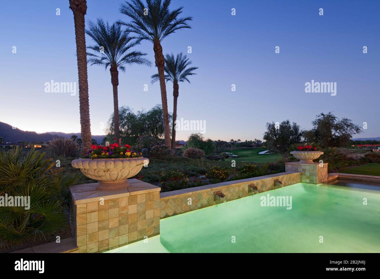 Swimming pool with landscape in background Stock Photo - Alamy