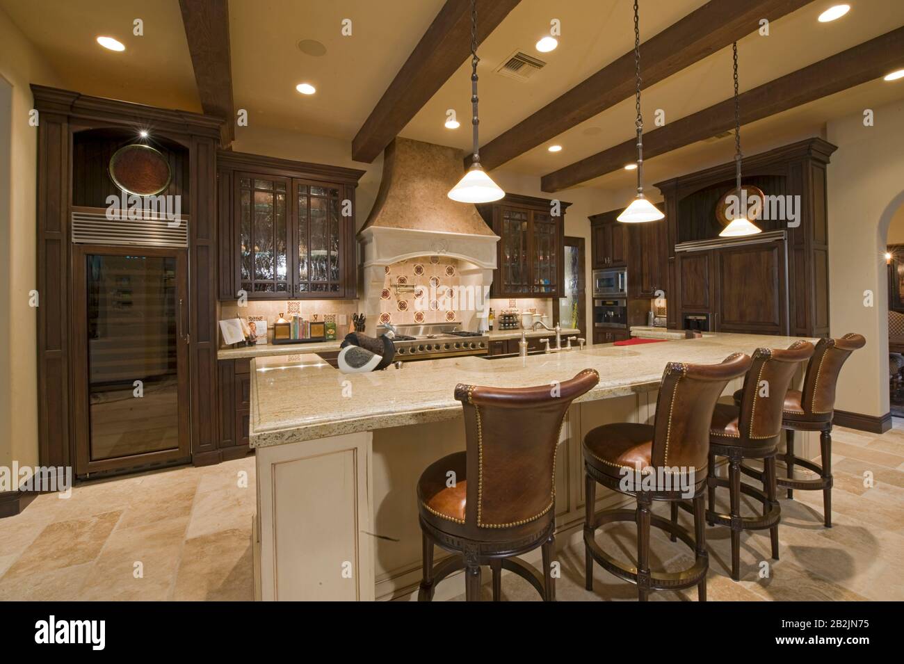 Contemporary kitchen counter with chair in luxury mansion Stock Photo ...