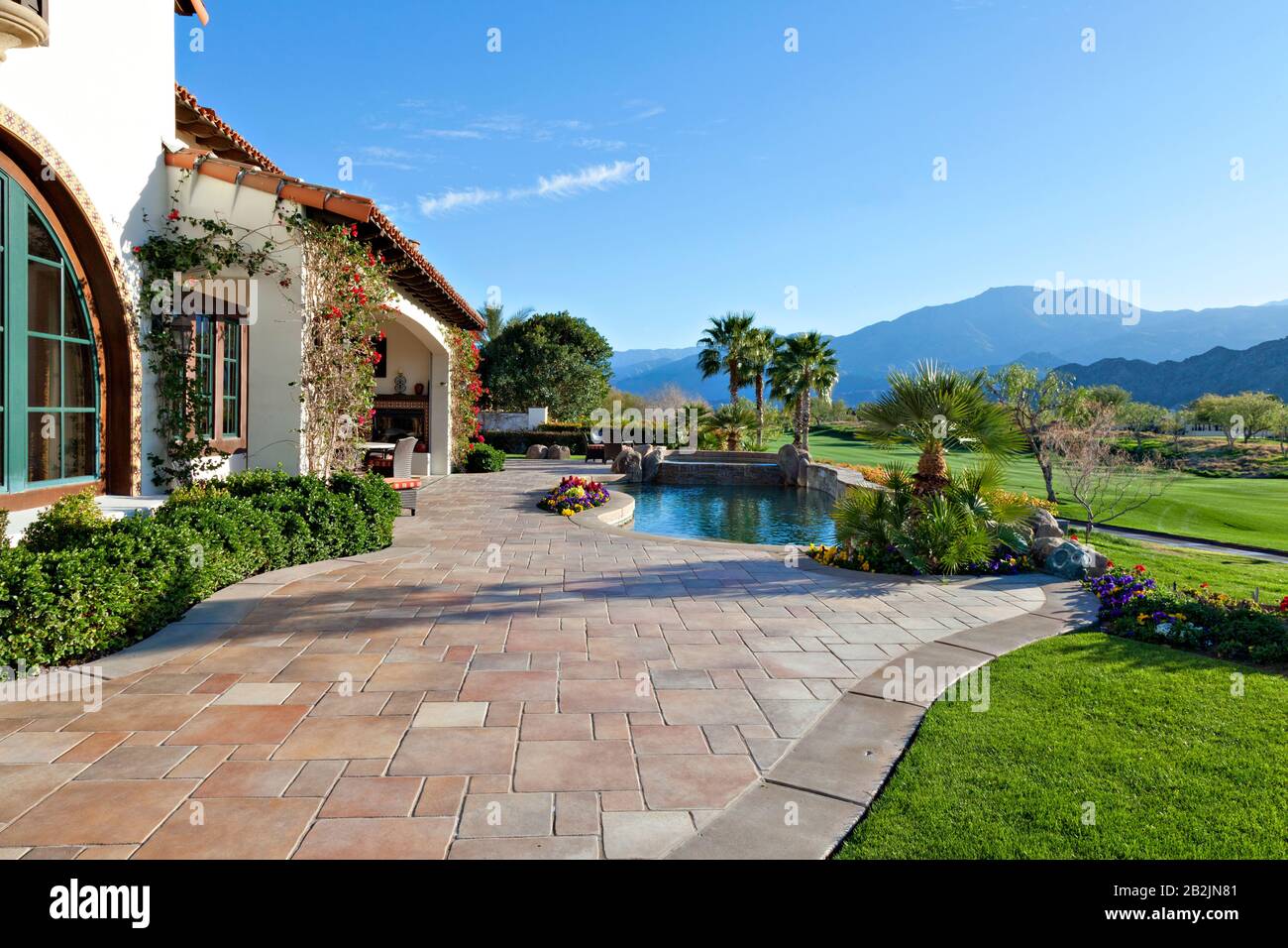 View of mountains and swimming pool from luxury manor house Stock Photo ...