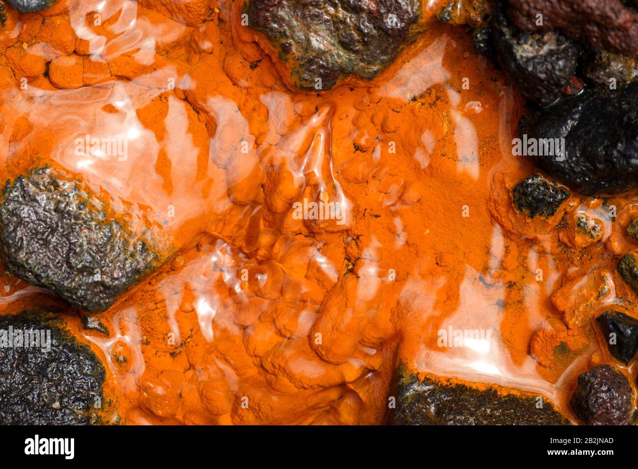 Orange Iron Oxide Sediments On Rocks Near Tungurahua Volcano Ecuador ...