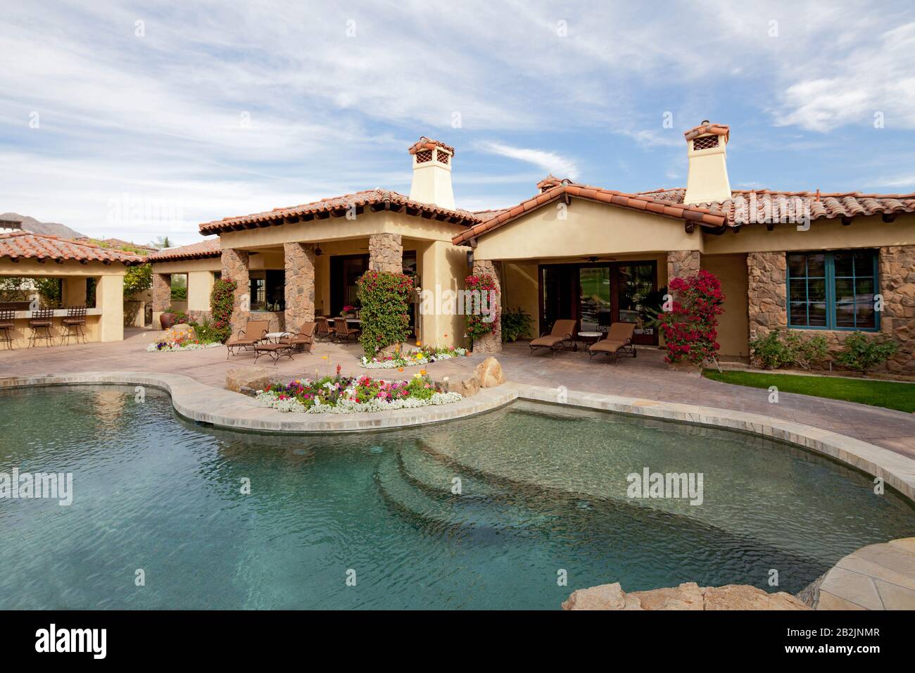 Swimming pool in front of luxurious mansion Stock Photo - Alamy