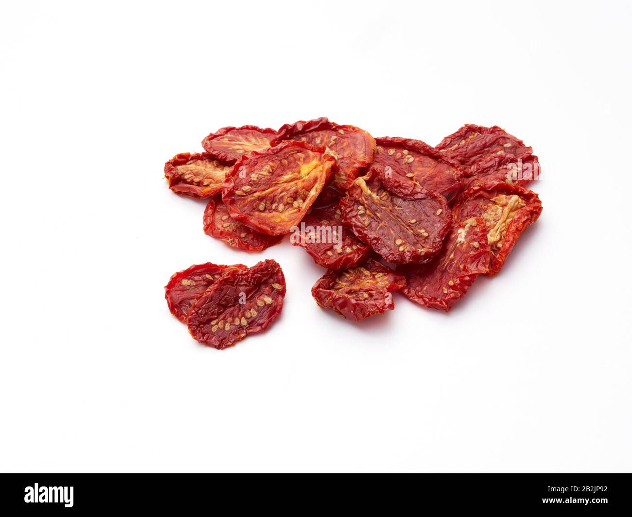 Sun Dried tomatoes in the sunshine on white Stock Photo - Alamy