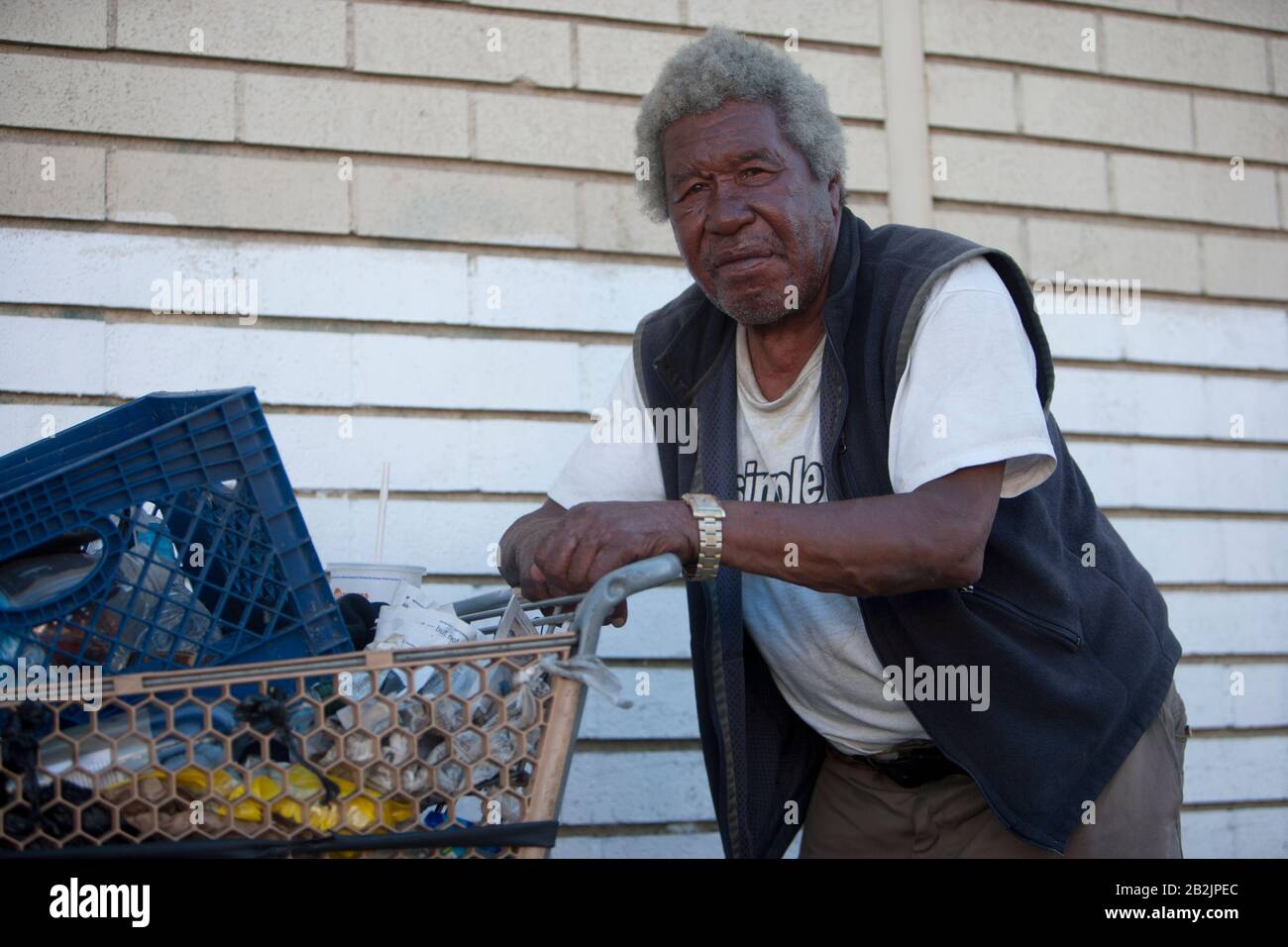 Portrait of homeless African American man with shopping cart Stock ...
