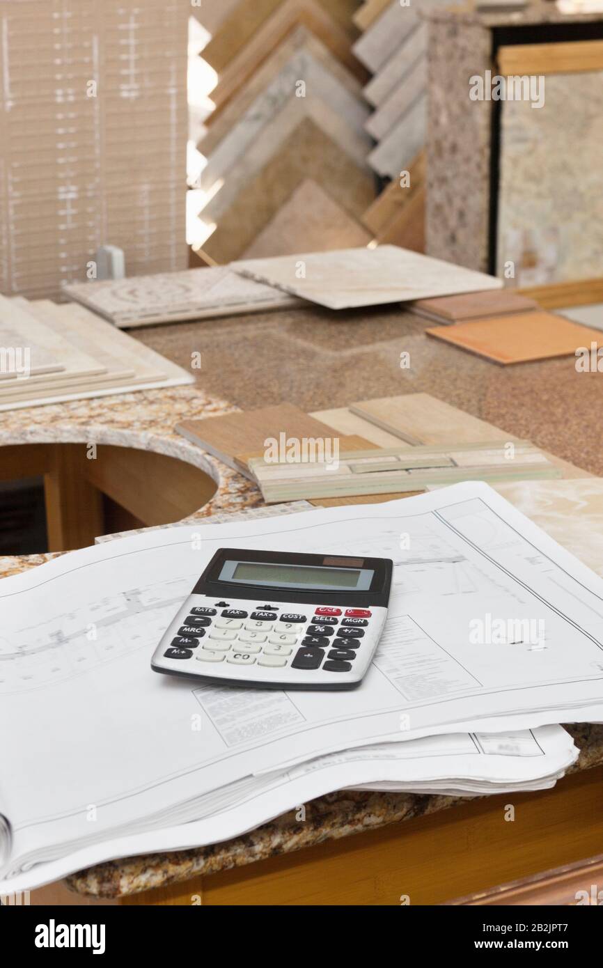 Calculator on paper in tiles store Stock Photo - Alamy