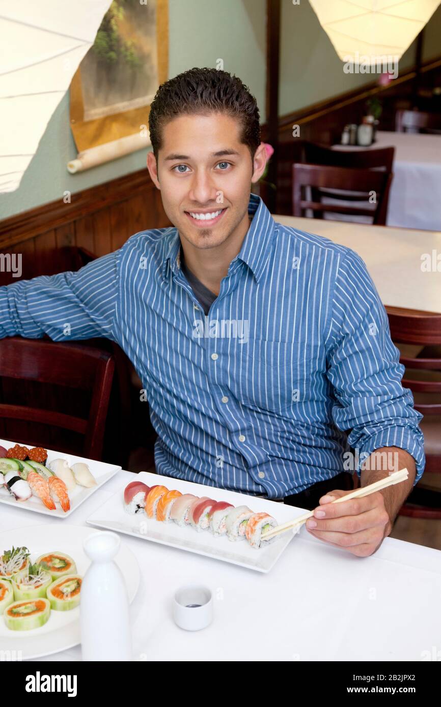 20s man eating fish hi-res stock photography and images - Alamy