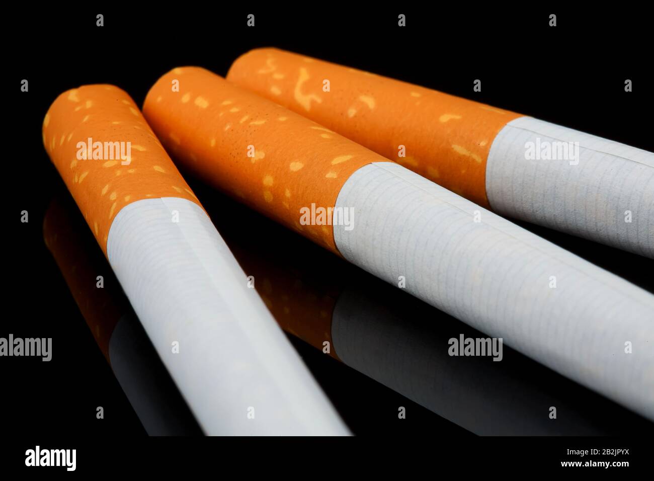 Three Cigarettes On Black Reflective Background Studio Close Up Shot ...