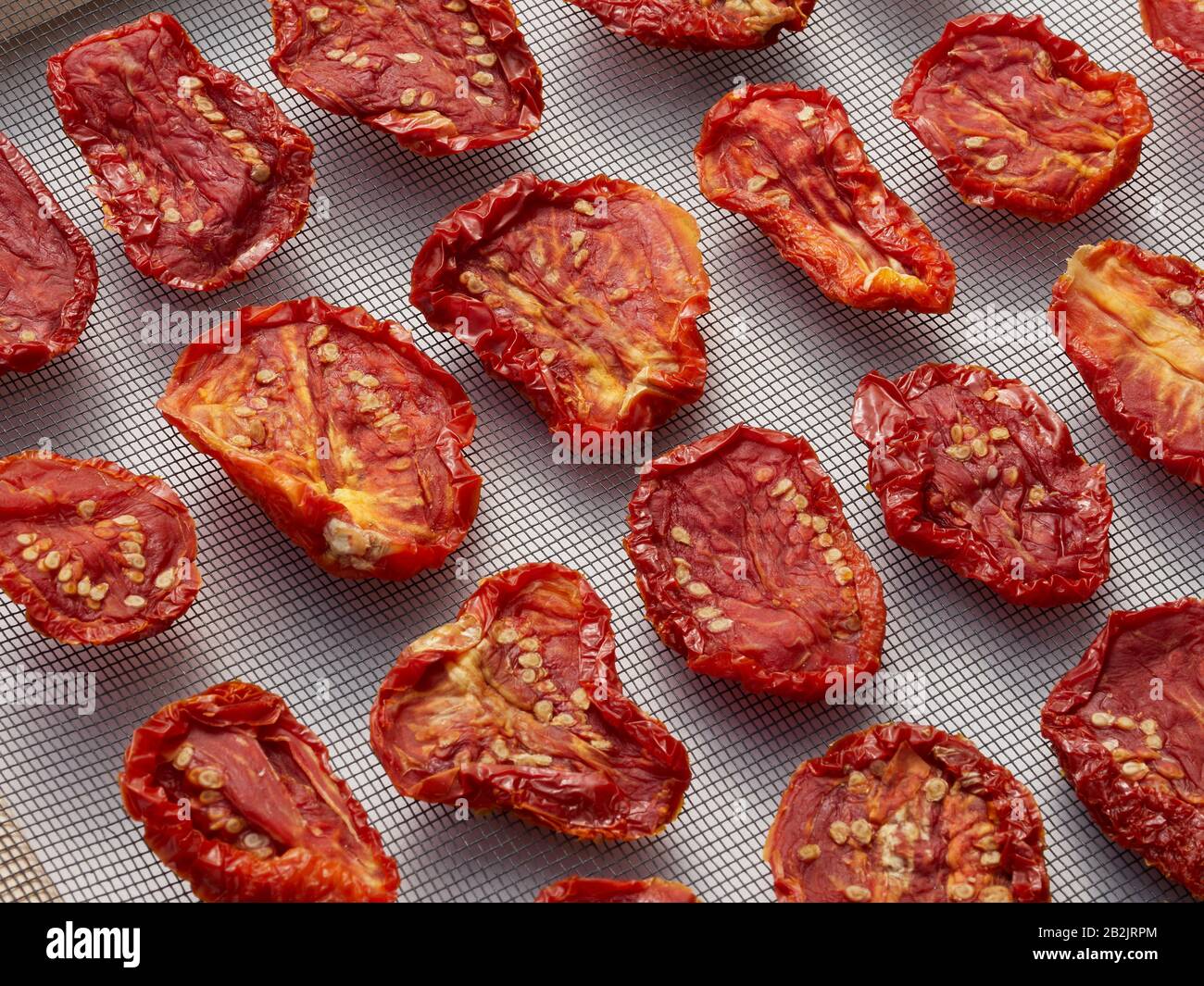 Sun Dried tomatoes in the sunshine on white Stock Photo - Alamy