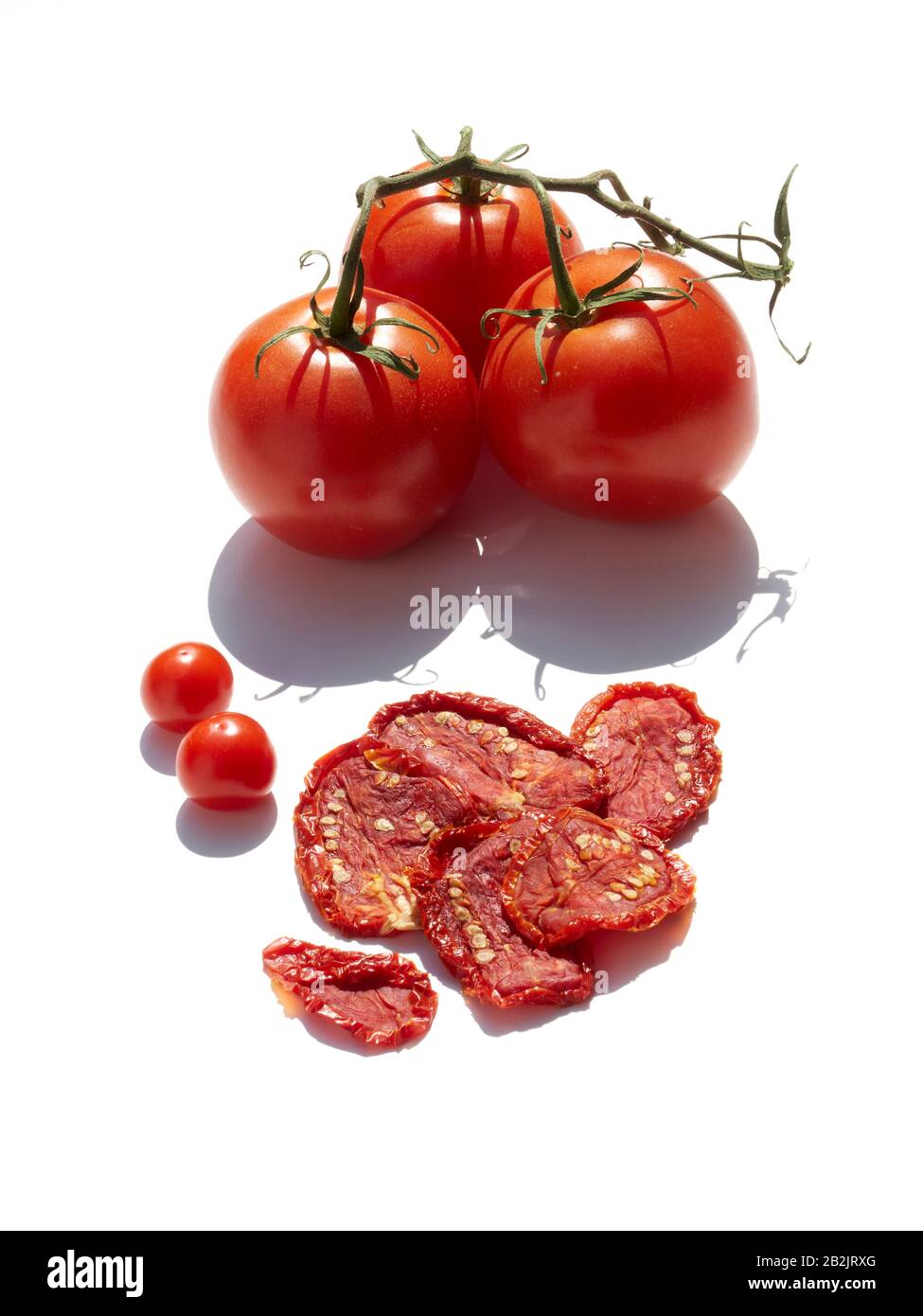 Sun Dried tomatoes in the sunshine on white Stock Photo - Alamy