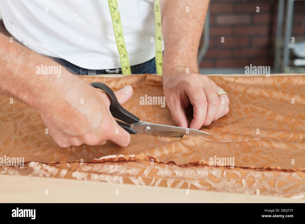 Mature dressmaker cutting fabric hi-res stock photography and images ...