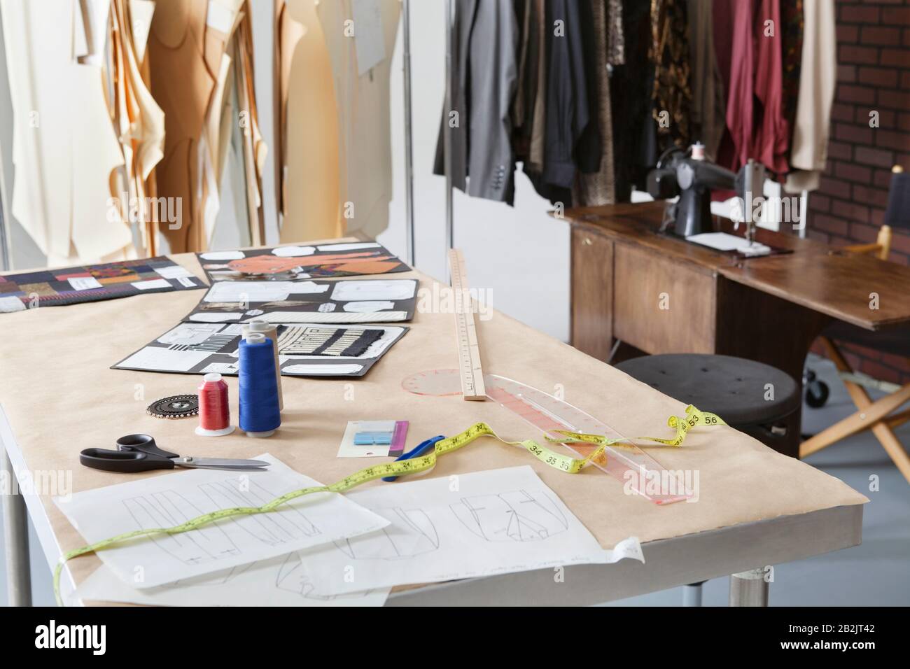 Fashion designing materials on table in design studio Stock Photo - Alamy