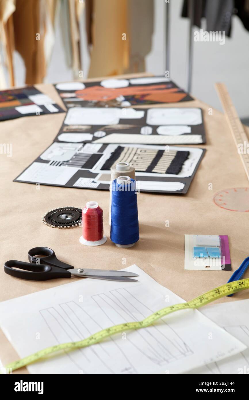 Fashion designing materials on table in design studio Stock Photo - Alamy