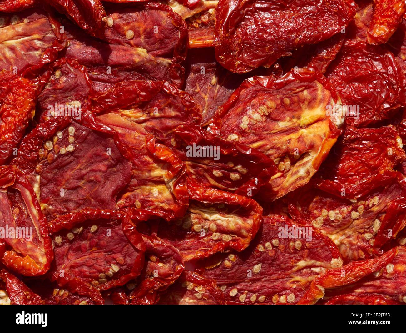 Sun Dried tomatoes in the sunshine on white Stock Photo - Alamy