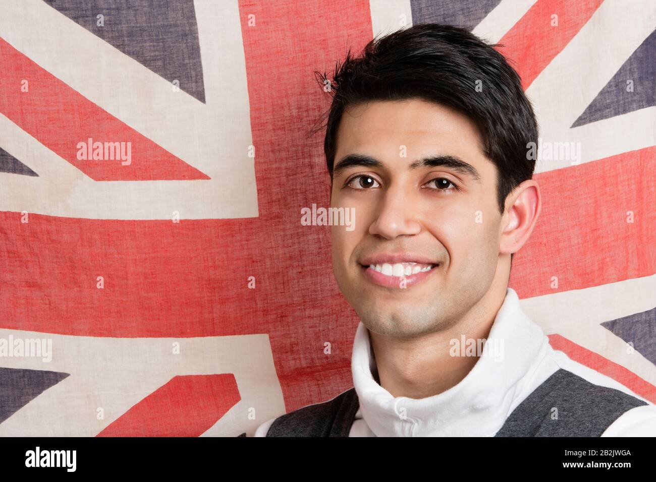 Portrait of patriotic young man with British flag in background Stock ...