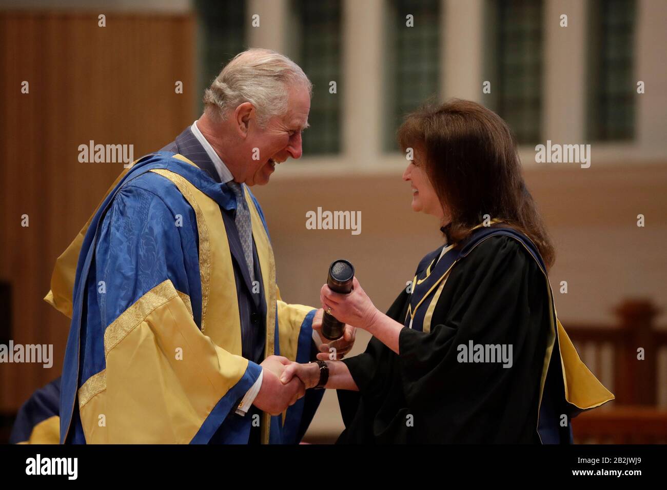 The Prince of Wales shakes hands as he presents British composer for ...