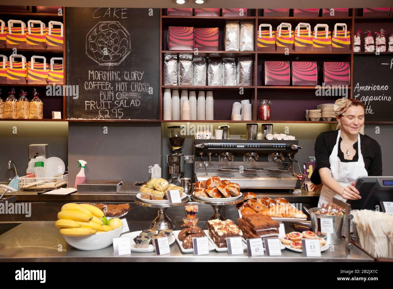 Bakery shop vendor in apron hi-res stock photography and images - Alamy