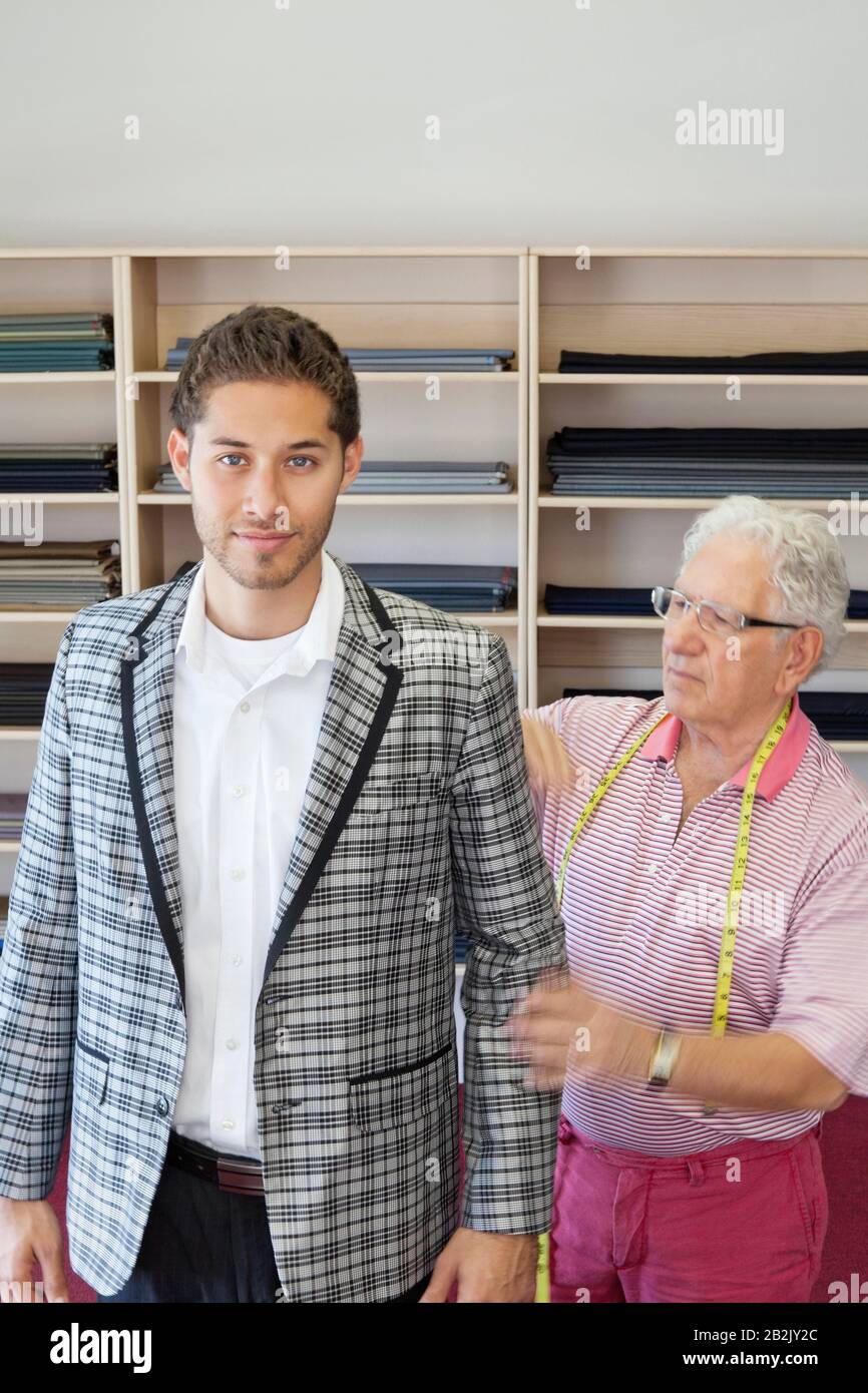 Young man handsome small suits hi-res stock photography and images - Alamy