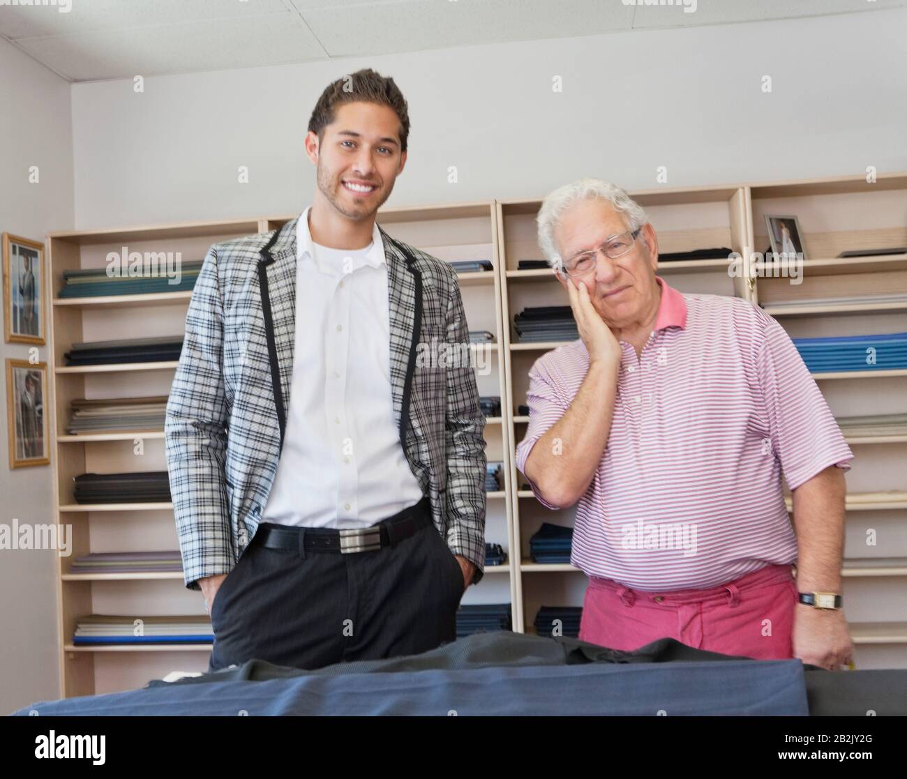 Portrait of young customer with shop owner Stock Photo - Alamy