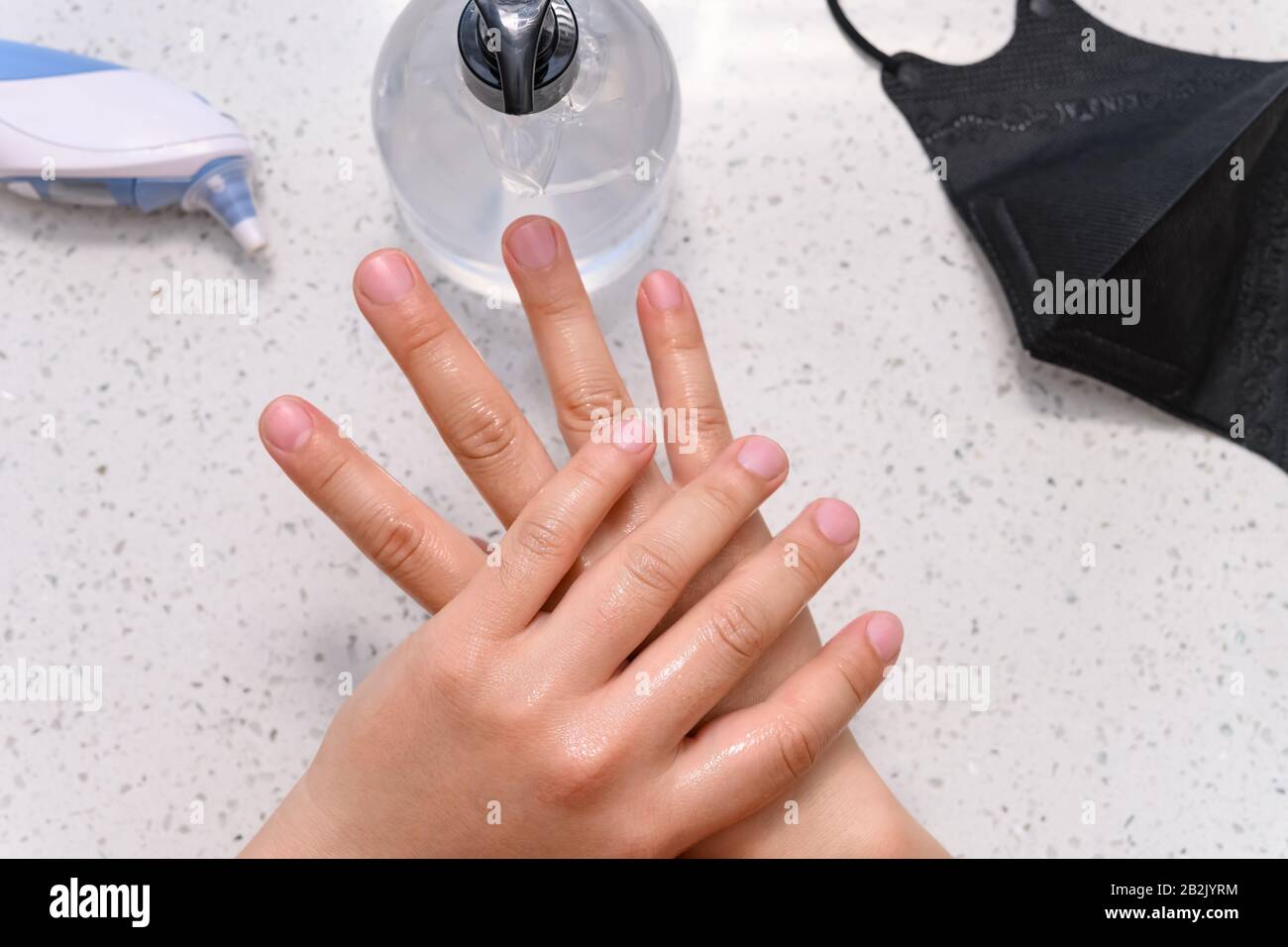 washing hands with instant hand sanitizer and thermo detector and ...
